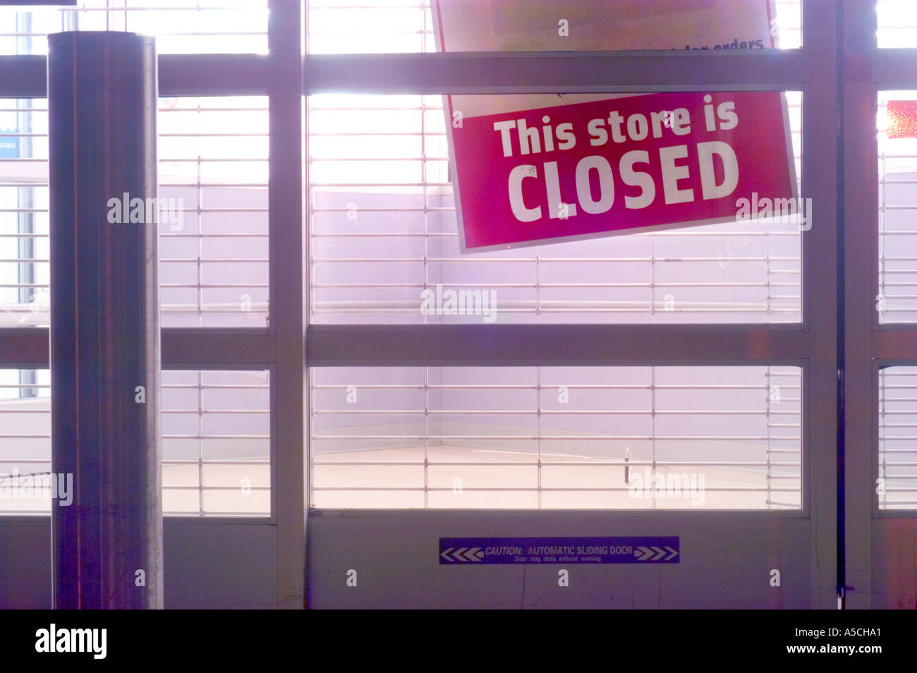 A horizontal color image of a modern store door with a big red This ...