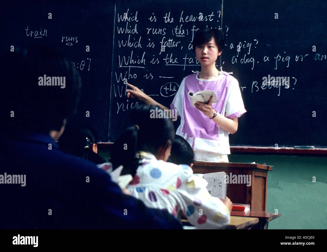 Middle school English language teacher in classroom Stock Photo - Alamy