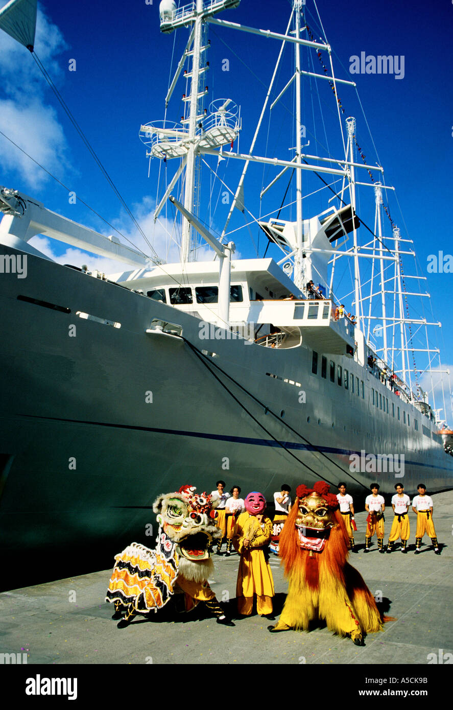 Hong Kong Chinese lion dancers welcome cruise ship at Kowloon dock ...
