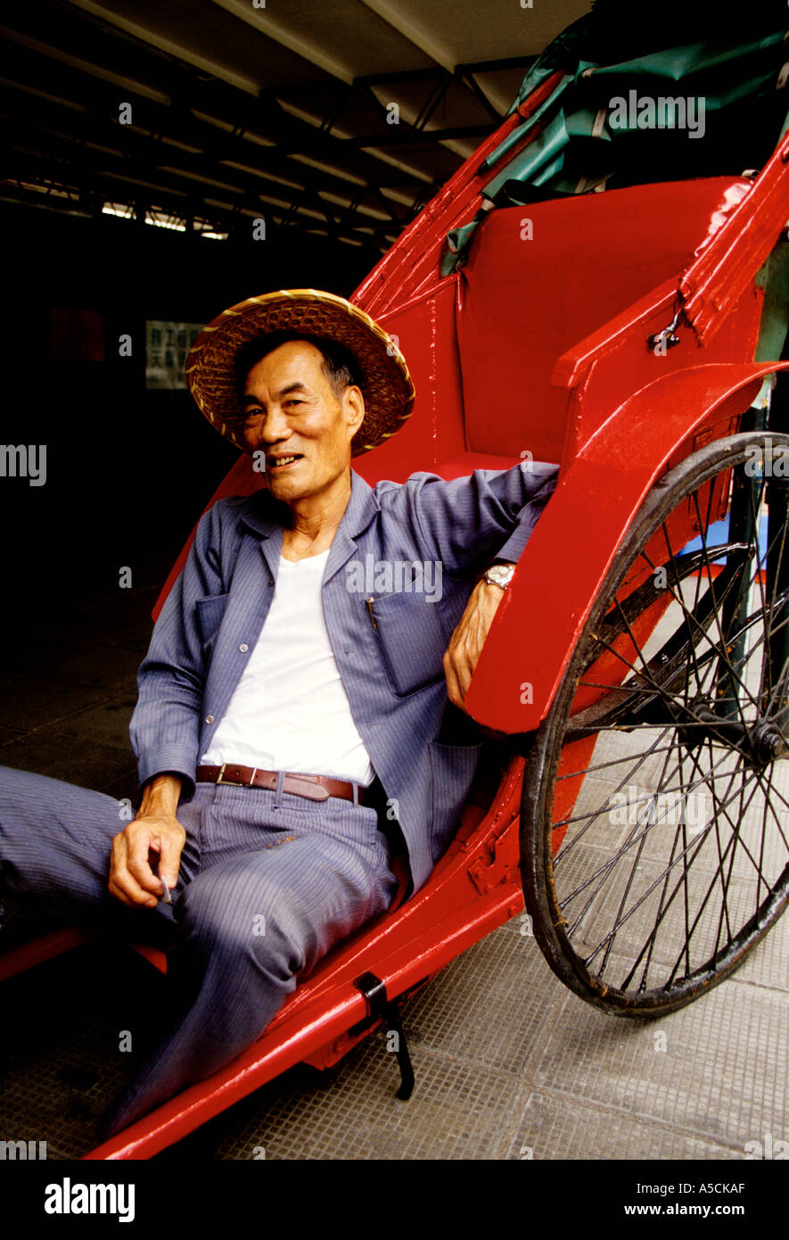Hong Kong Rickshaw driver on break at Hong Kong Central Star Ferry ...