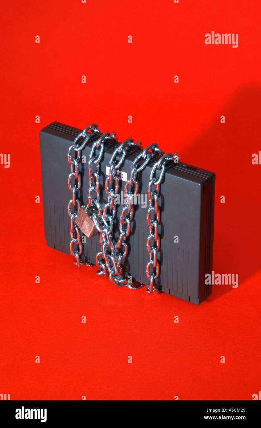 Laptop in chains Stock Photo - Alamy