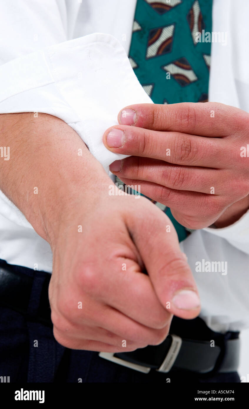 Man rolling up sleeves work hi-res stock photography and images - Alamy