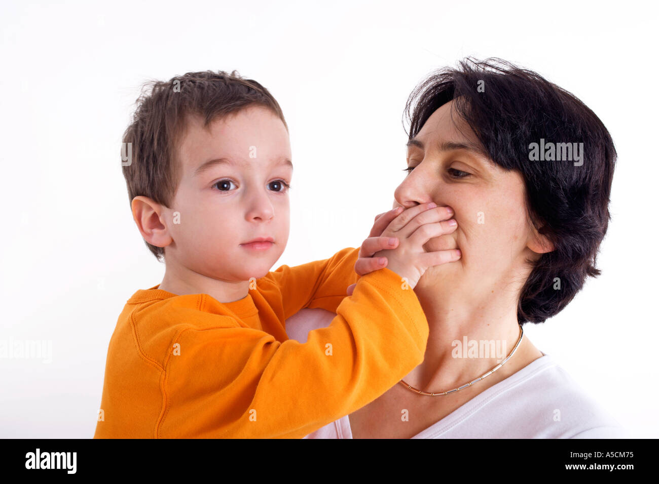 Little boy shutting his mother up Stock Photo - Alamy