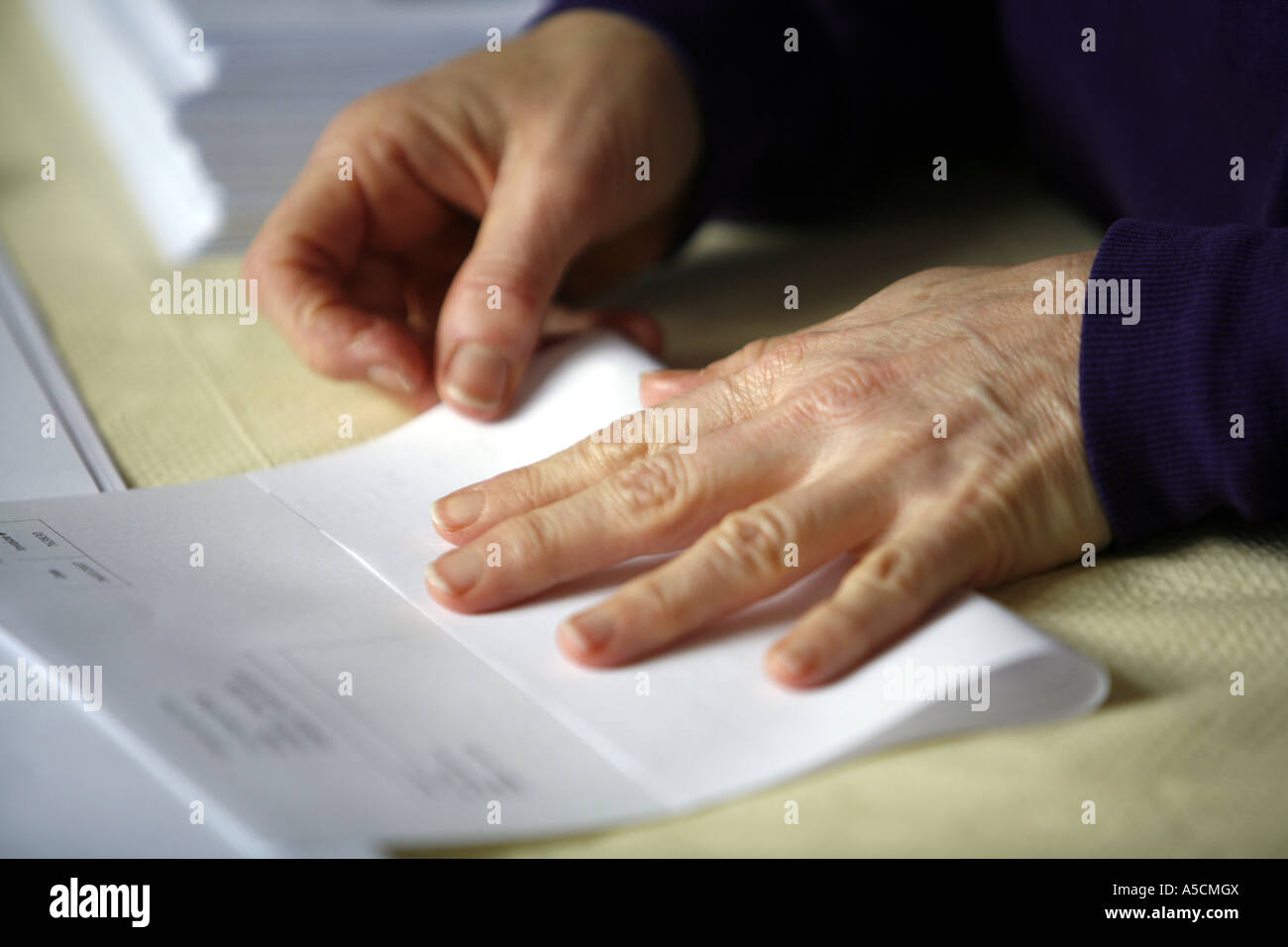 Hands stuffing envelopes hi-res stock photography and images - Alamy