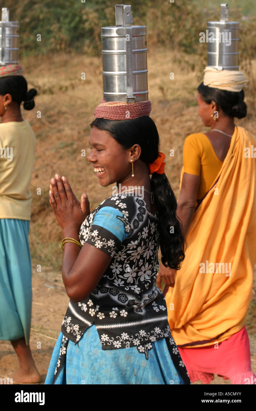 Pretty local girls in bright saris make their way to market in western ...