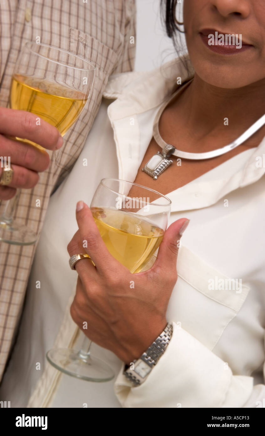 Hispanic couple making a champagne toast Stock Photo - Alamy
