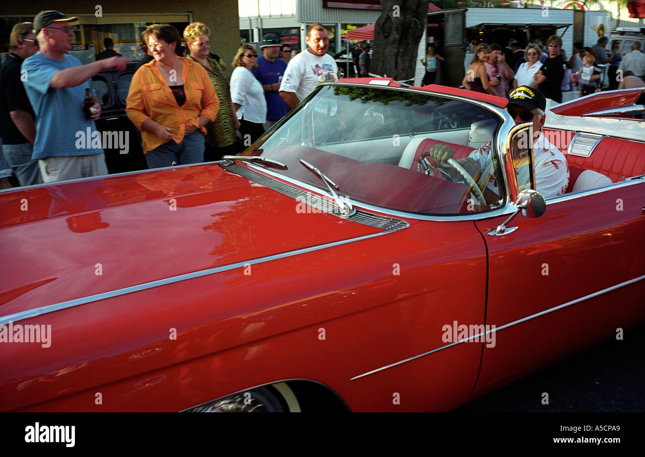 A driver arrives in a red convertible for the Hot Rod evening in ...