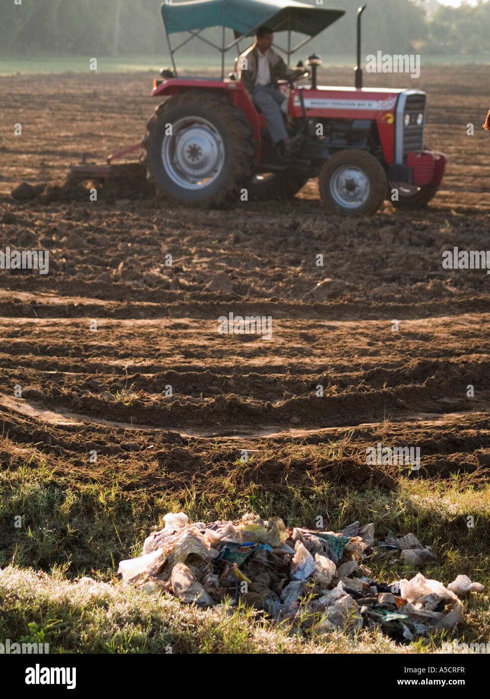 Trash on the edge of a farm field Stock Photo - Alamy