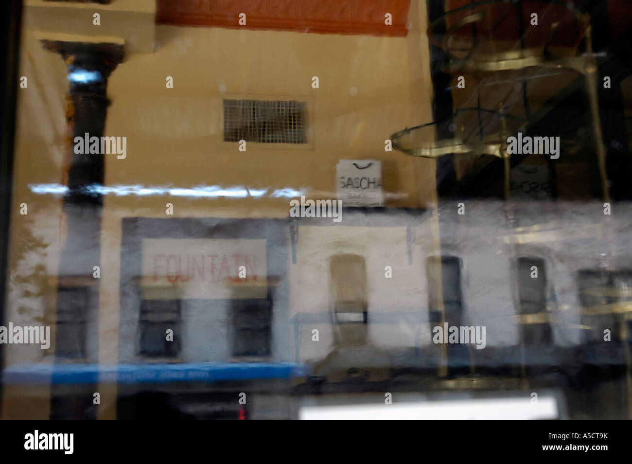 Buildings are reflected in the windows of the Sacha Bakery Restaurant ...