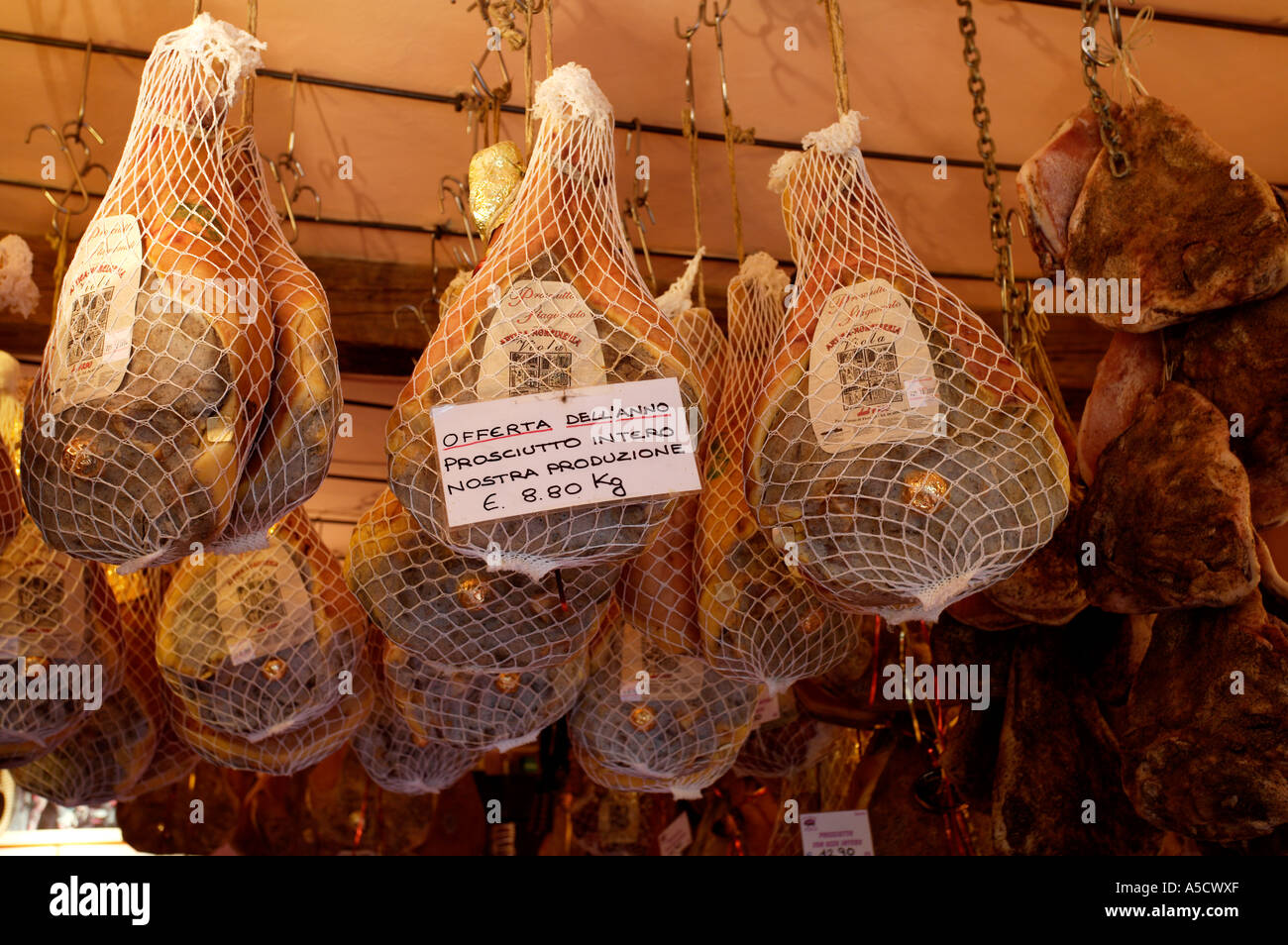 PROSCIUTTO HAM HANGING UP IN ANNIBALE DELICATESSEN ROME FOR SALE Stock ...