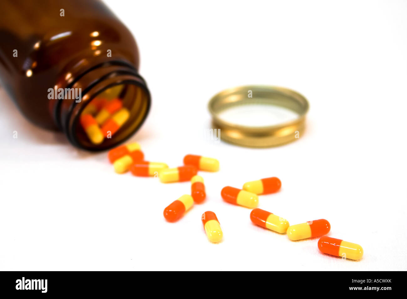 Detail of medicine bottles with spilled pills Stock Photo - Alamy