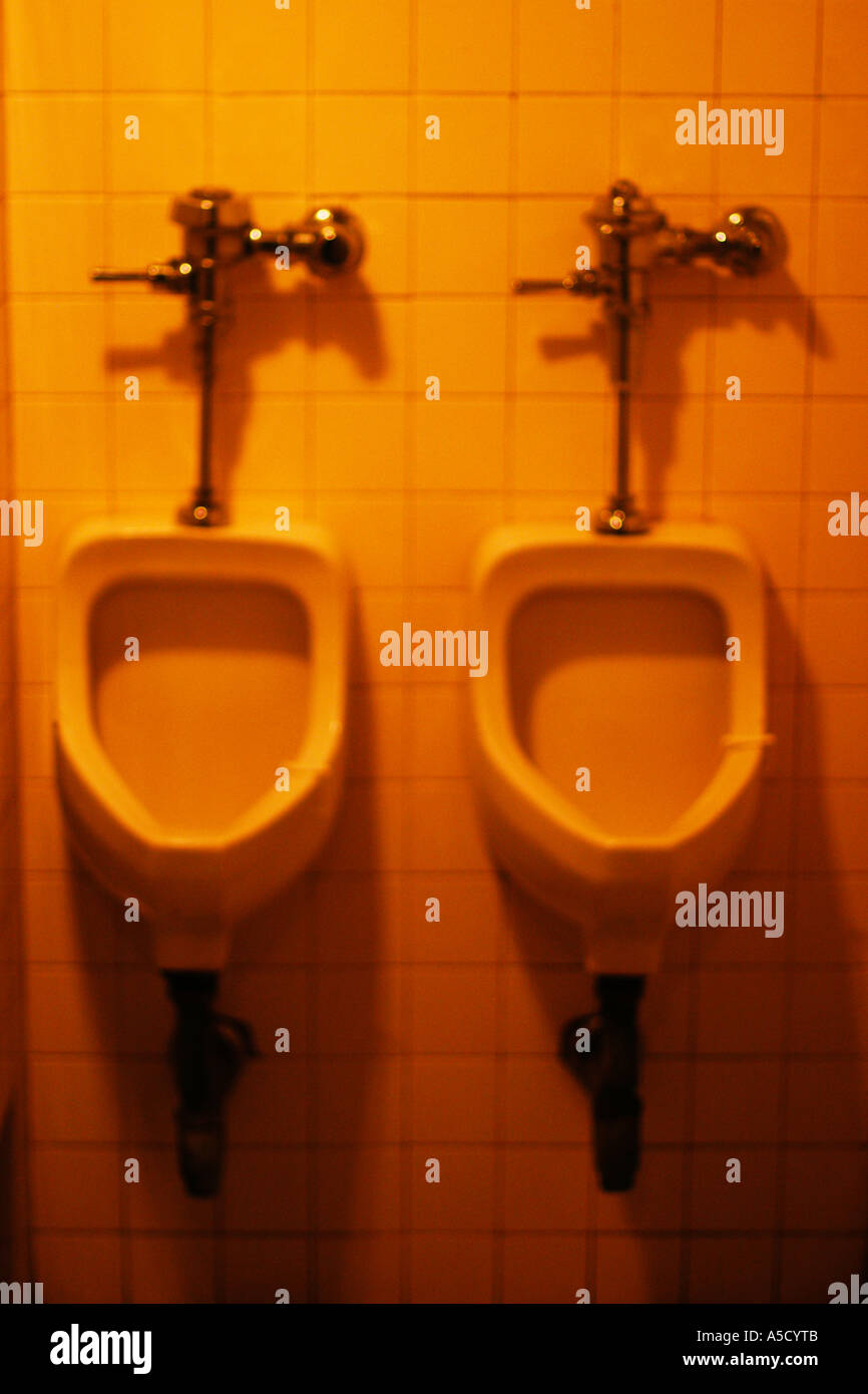 Urinals in bar bathroom in New York City Stock Photo - Alamy