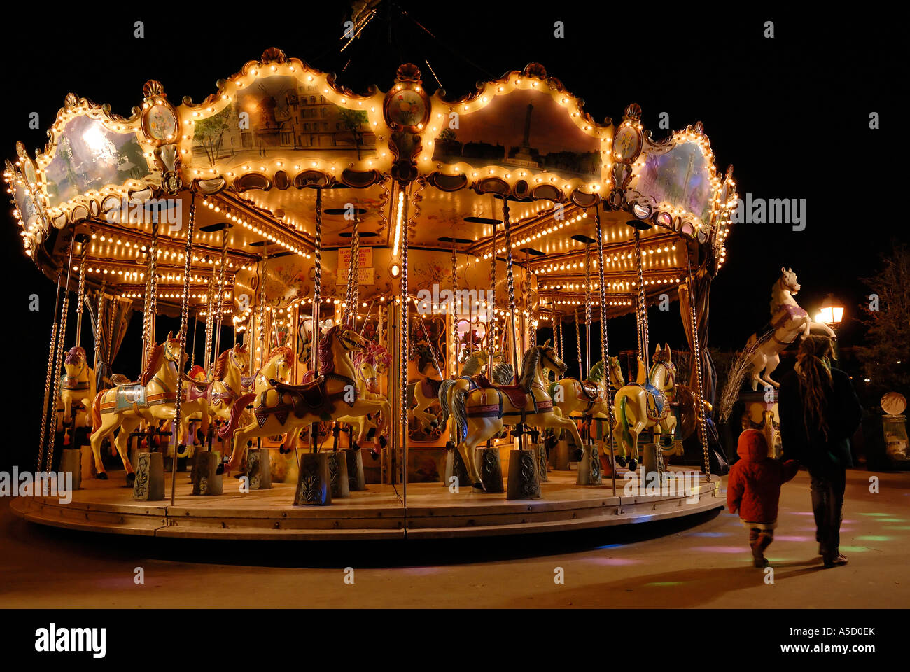 Paris merry go round night hi-res stock photography and images - Alamy