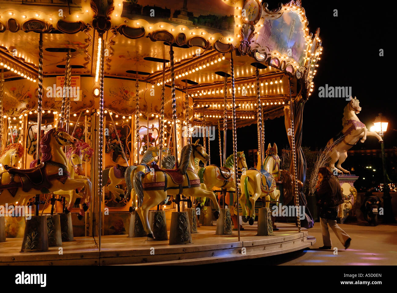 Merry go round at night in Paris Stock Photo - Alamy