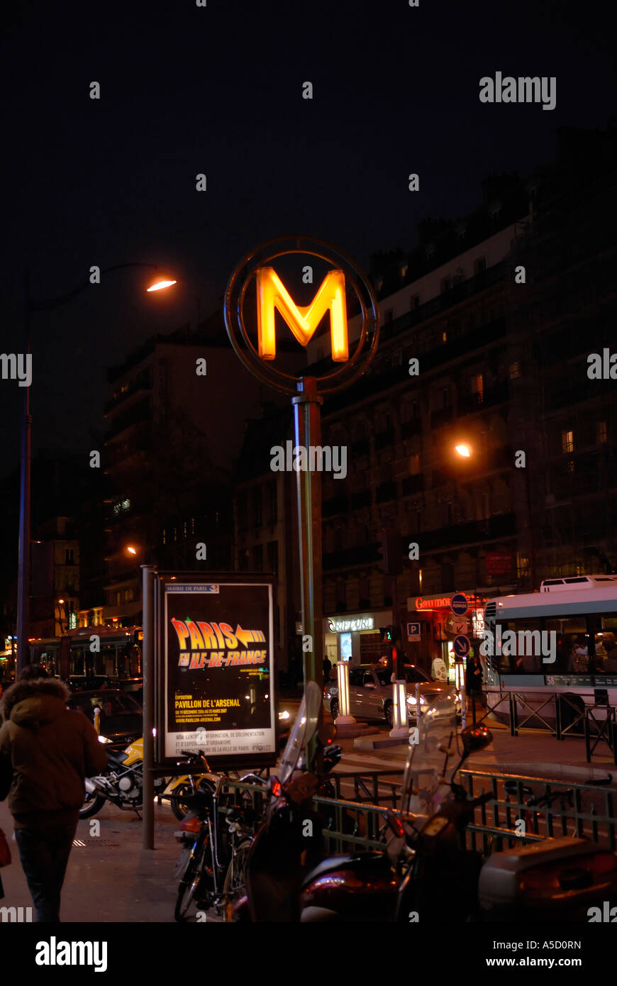 Paris Metro sign at night Stock Photo - Alamy