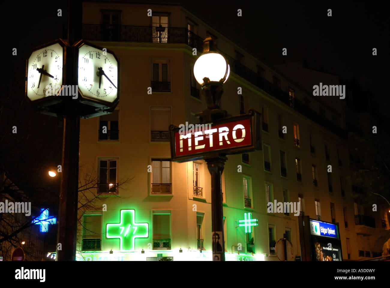 Paris Metro sign at night Stock Photo - Alamy