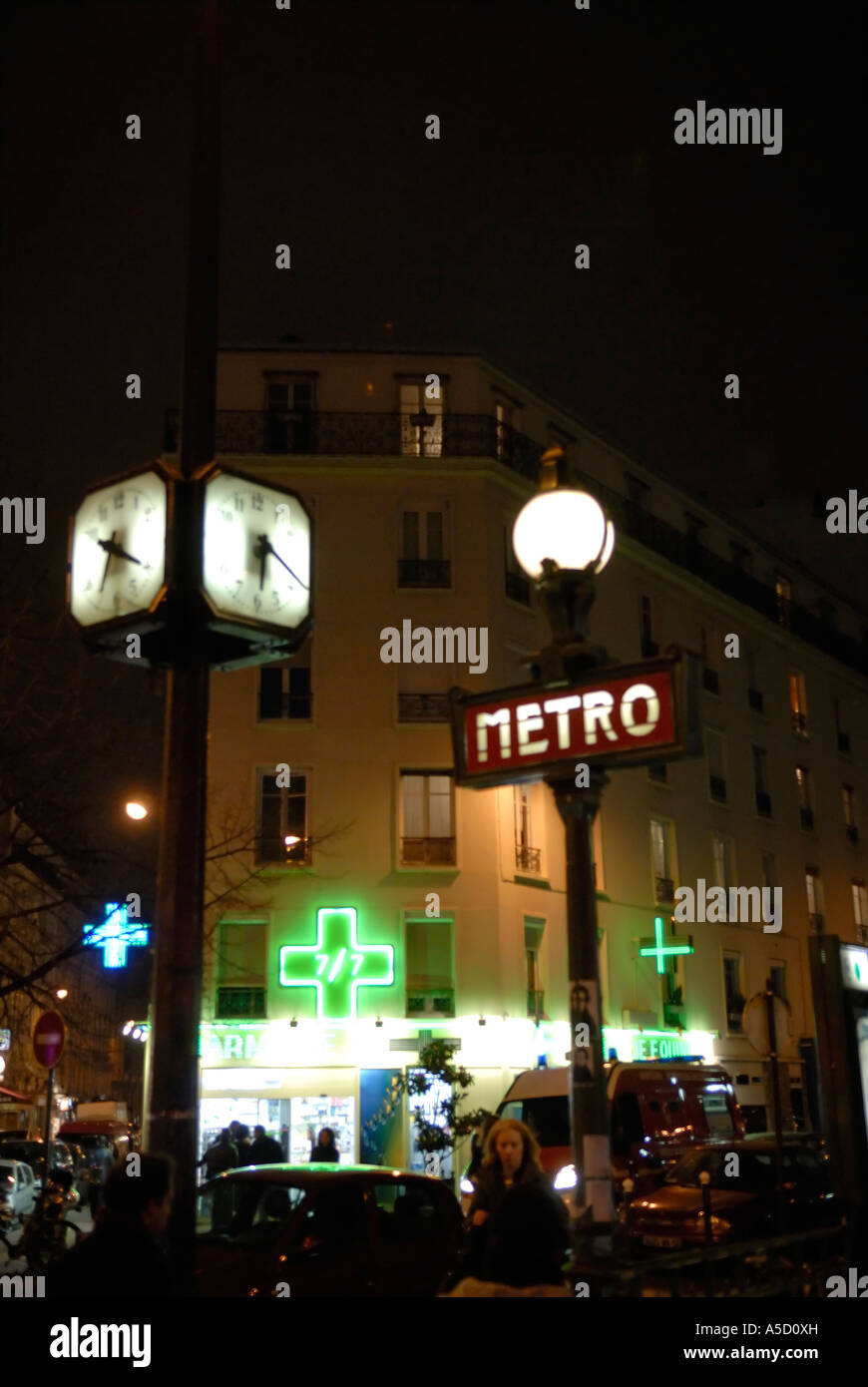 Paris Metro sign at night Stock Photo - Alamy