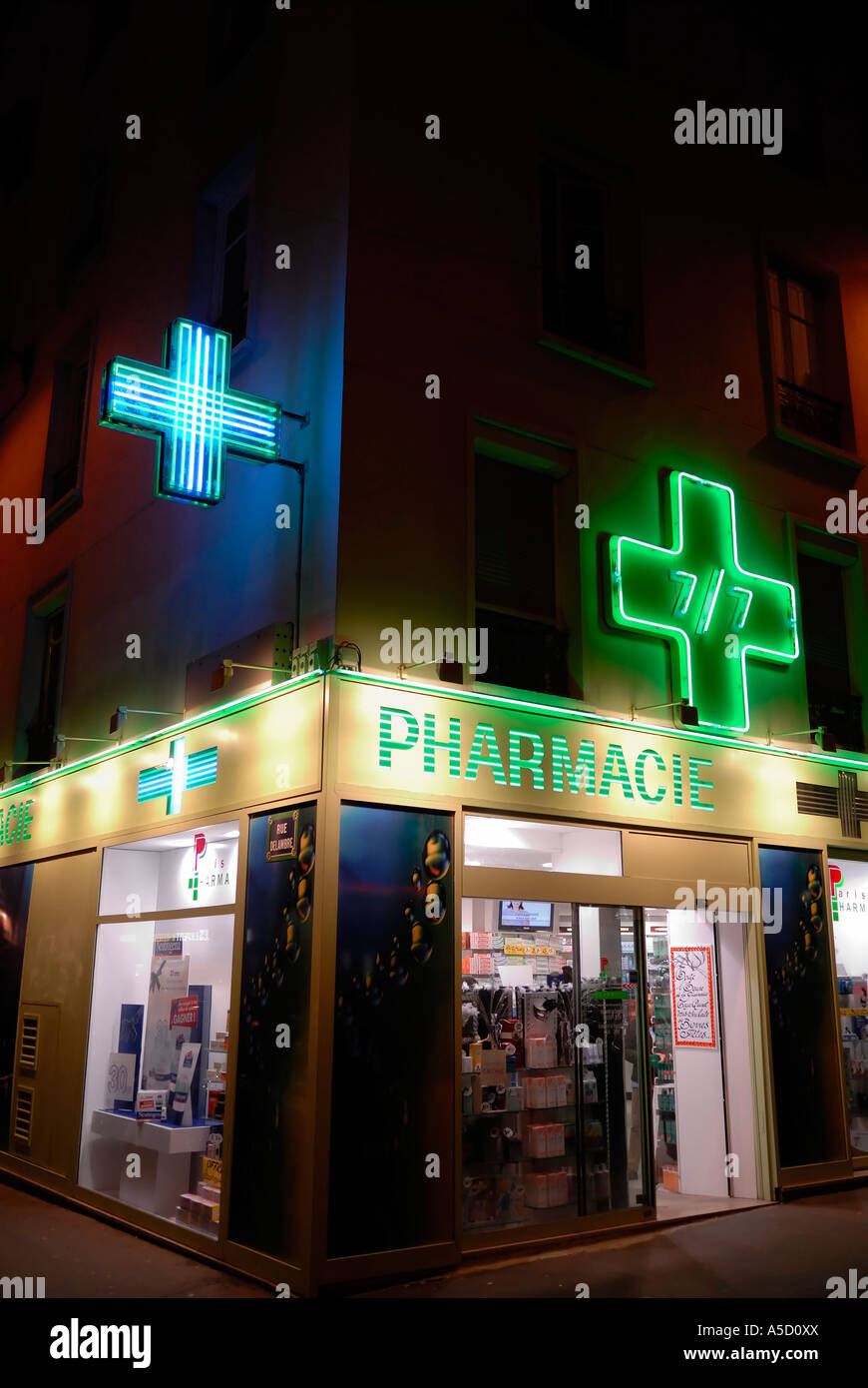 Health signs at night Paris France Stock Photo - Alamy