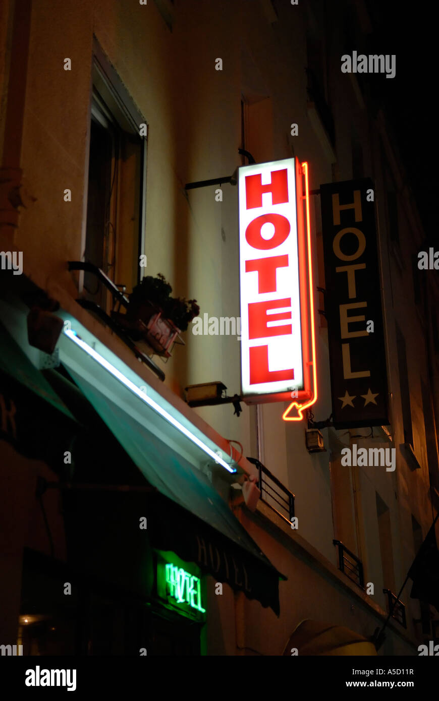 Hotel sign at night in Paris Stock Photo - Alamy