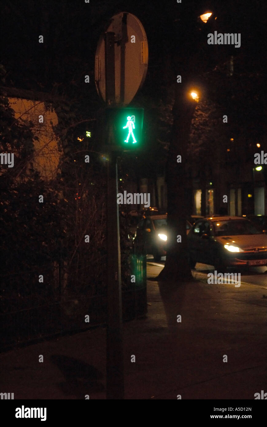green light pedestrian traffic lights in Paris at night Stock Photo - Alamy