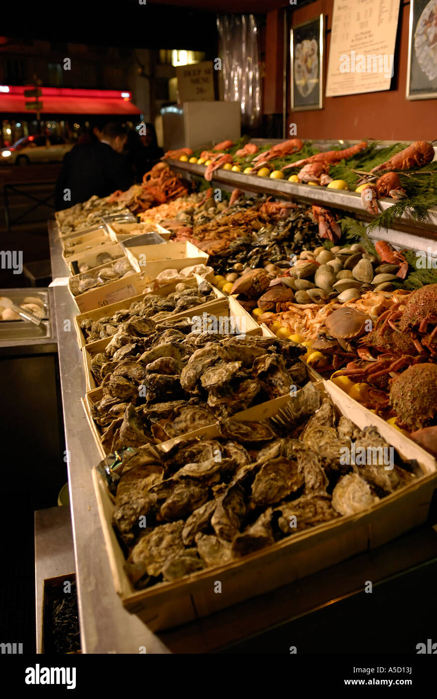 Seafood in a front of a restaurant in Paris at night Stock Photo - Alamy