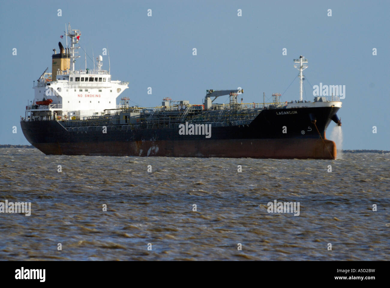 Container ship off a beach on Bolivar peninsula Stock Photo - Alamy