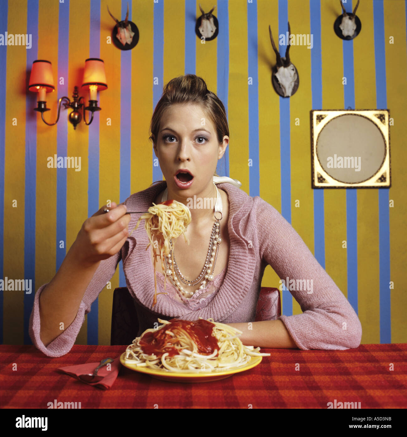 Woman indulging spaghetti hi-res stock photography and images - Alamy