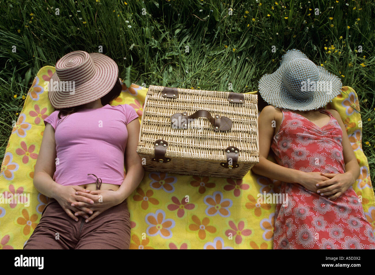 Woman covering face hat lying hi-res stock photography and images - Alamy