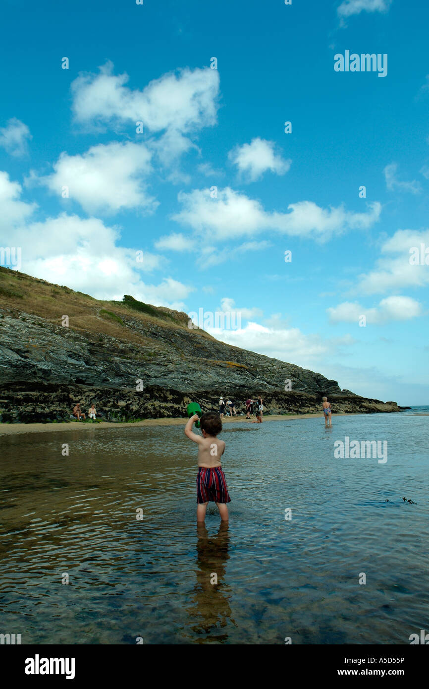 Young boy walking in the water in Belle Ile en Mer Stock Photo - Alamy