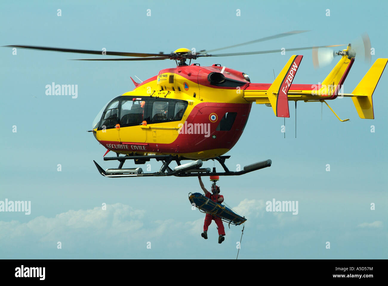Helicopter rescuing people fallen from a cliff in Brittany Stock Photo ...