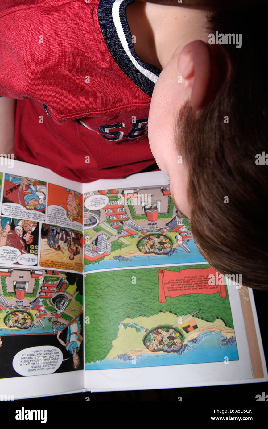 Teen reading comic hi-res stock photography and images - Alamy