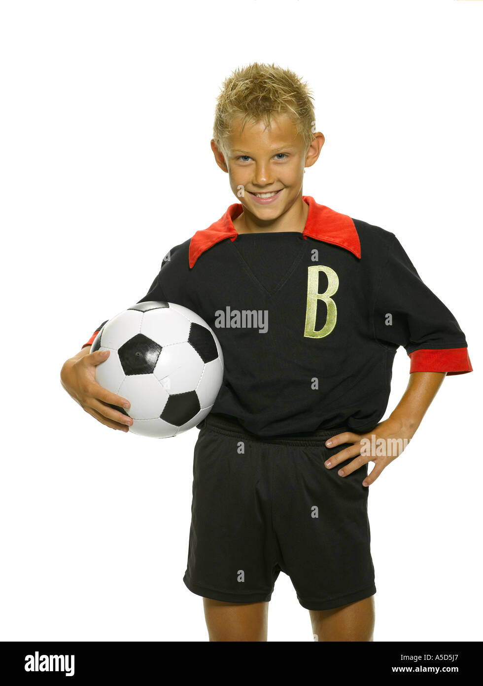 Boy with football, close-up Stock Photo - Alamy