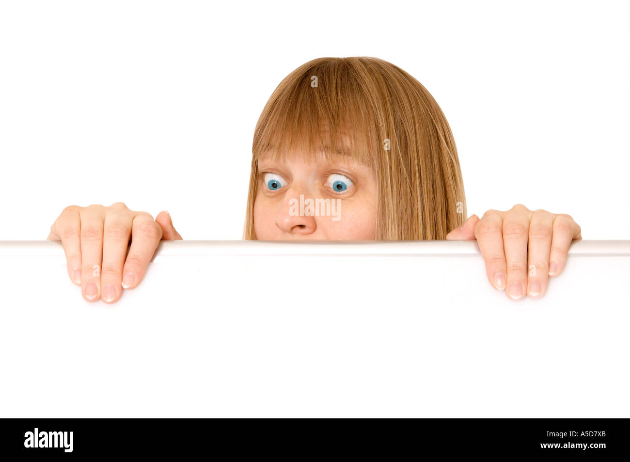 Mid adult woman looking over edge Stock Photo - Alamy