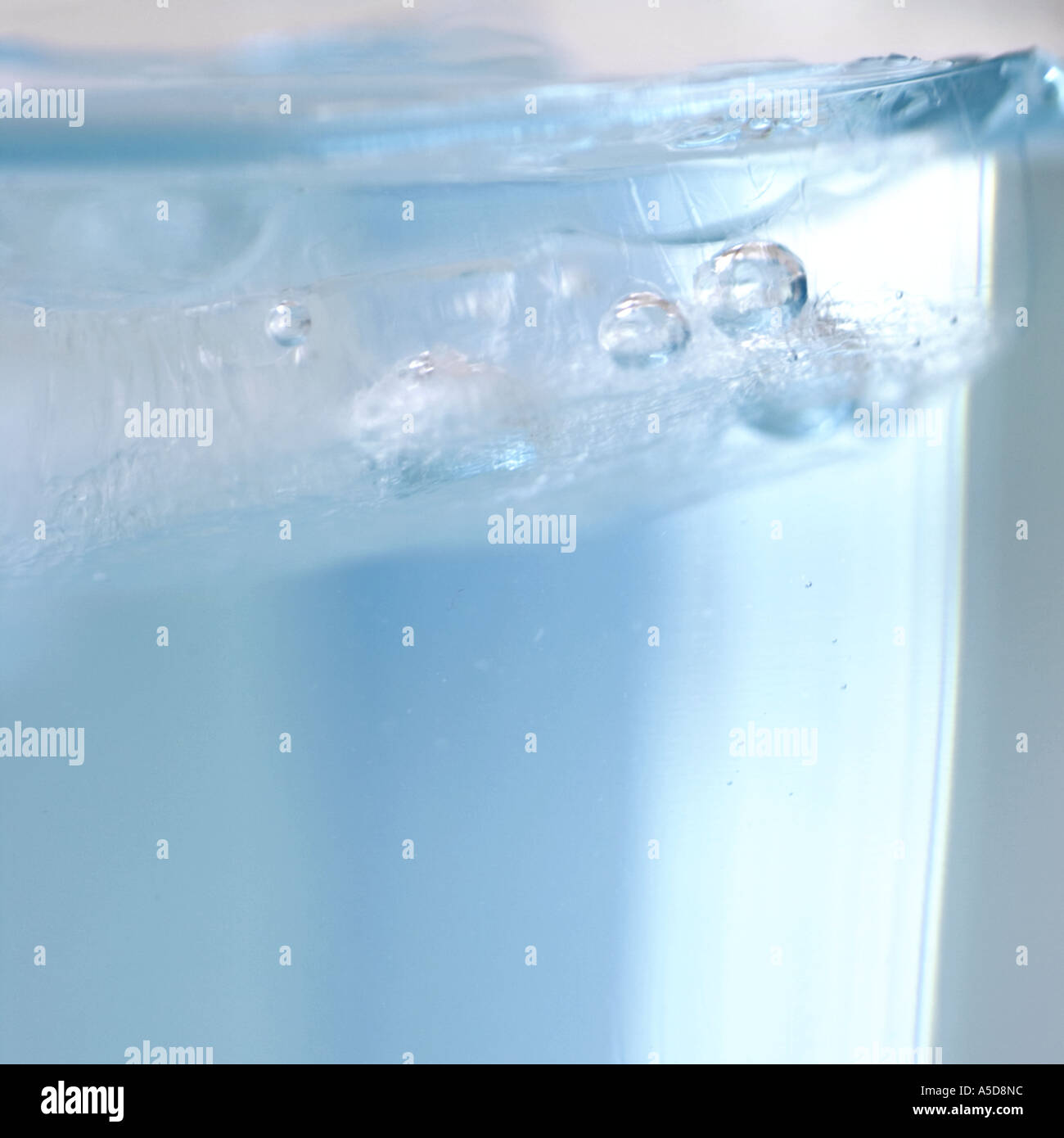 Air bubbles in a water glass, close-up Stock Photo - Alamy