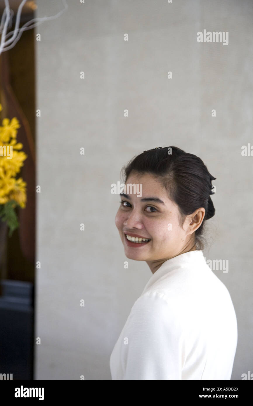 Female hotel worker at five star hotel posing in interior with ...