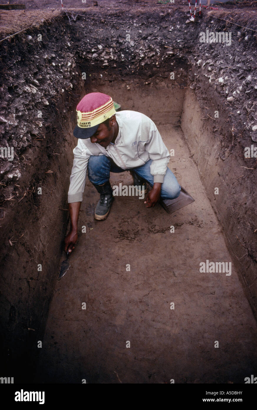 Student archaeologist digging at an excavation at Fort Mose ...