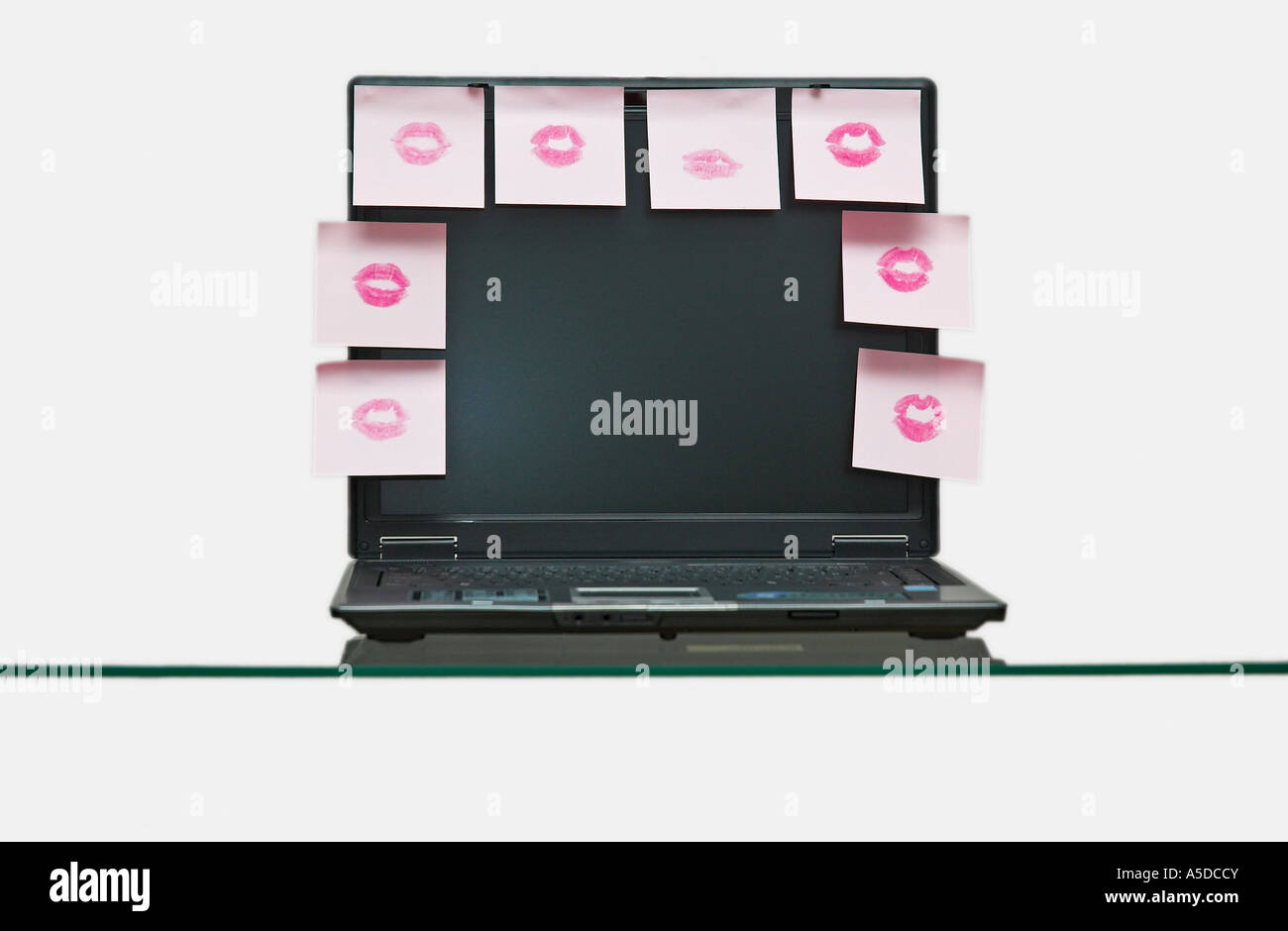 Lipstick kisses on adhesive notes on laptop computer Stock Photo - Alamy