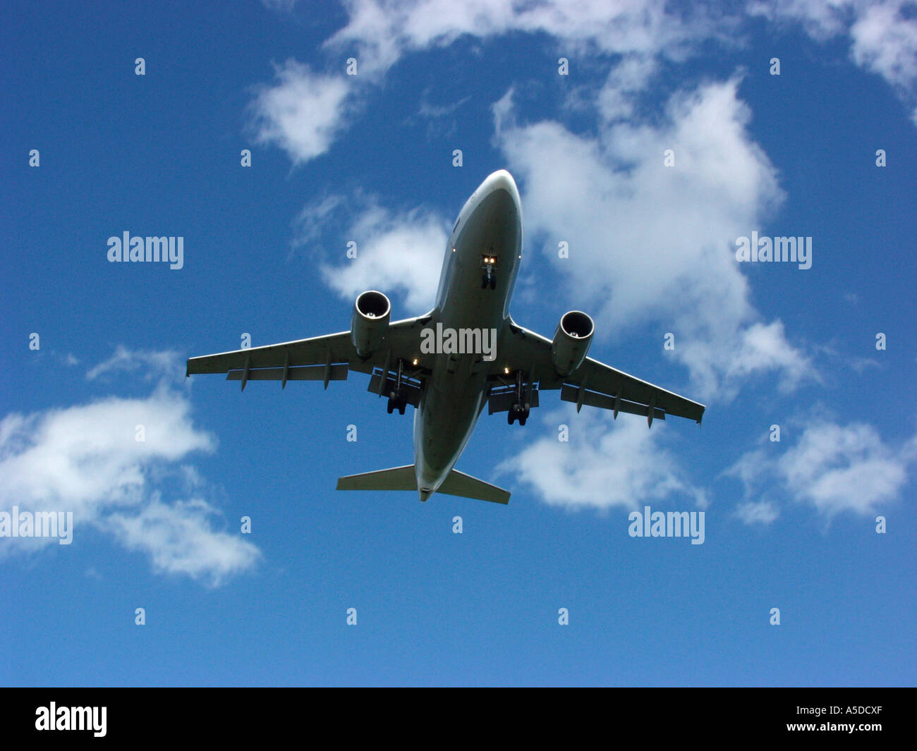 Jet aircraft flying, low angle view Stock Photo - Alamy