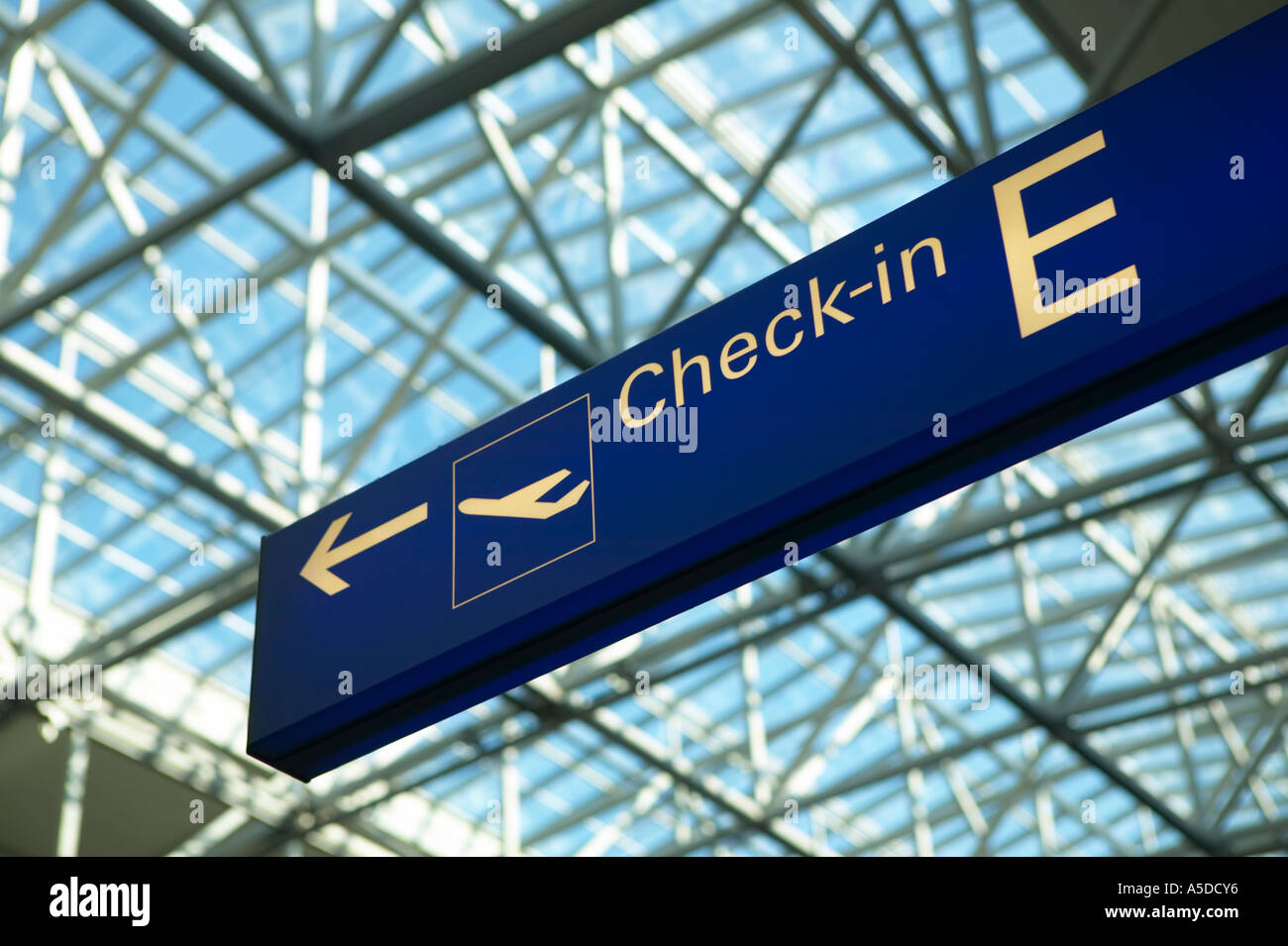 Check-in sign at airport, low angle view Stock Photo - Alamy