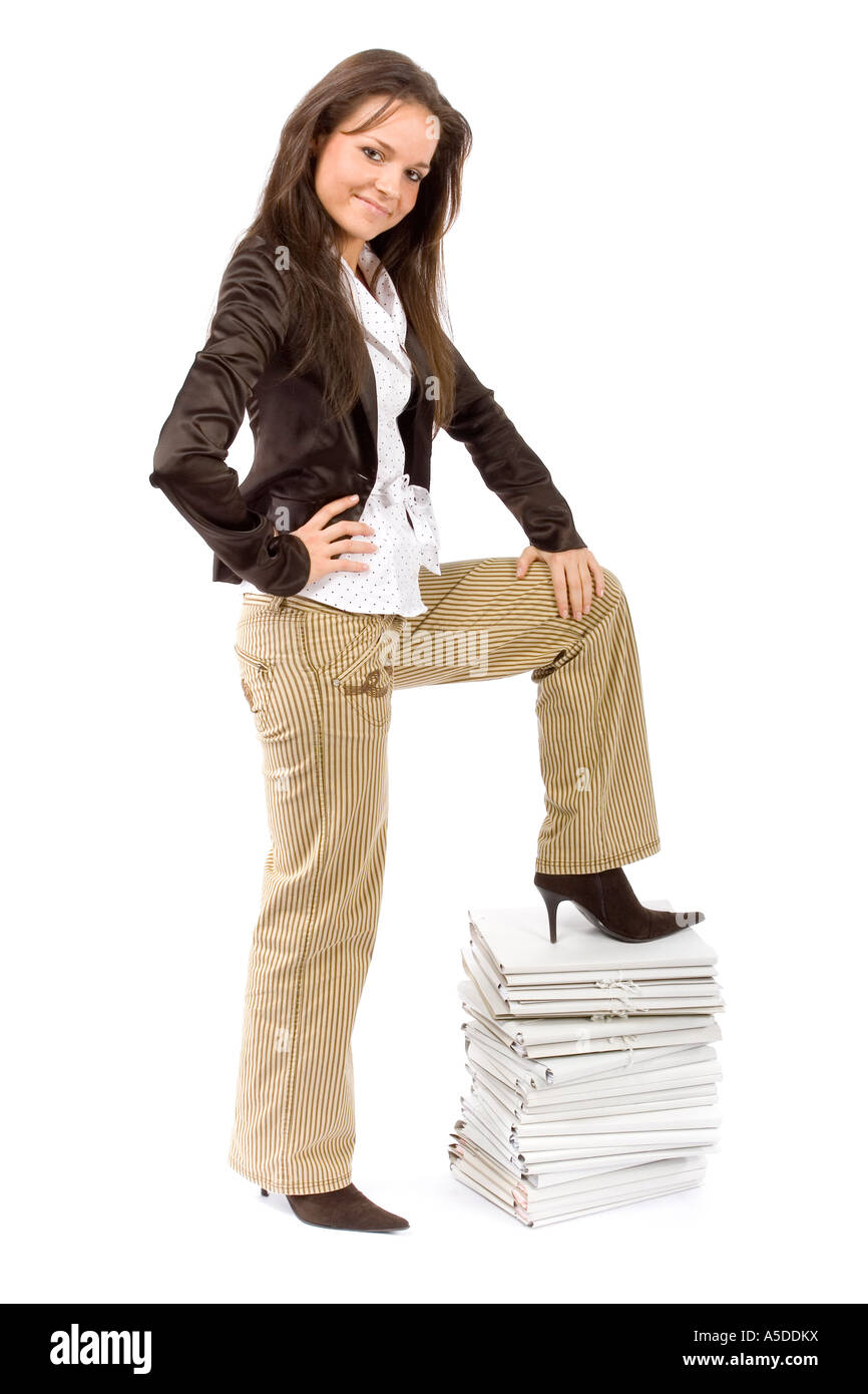 successful woman standing on the pile of files white background Stock ...