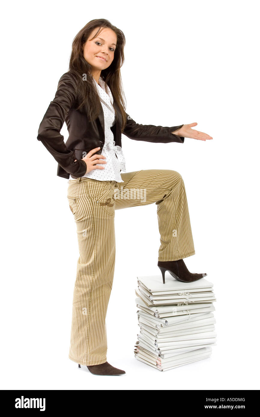 successful woman standing on the pile of files white background Stock ...