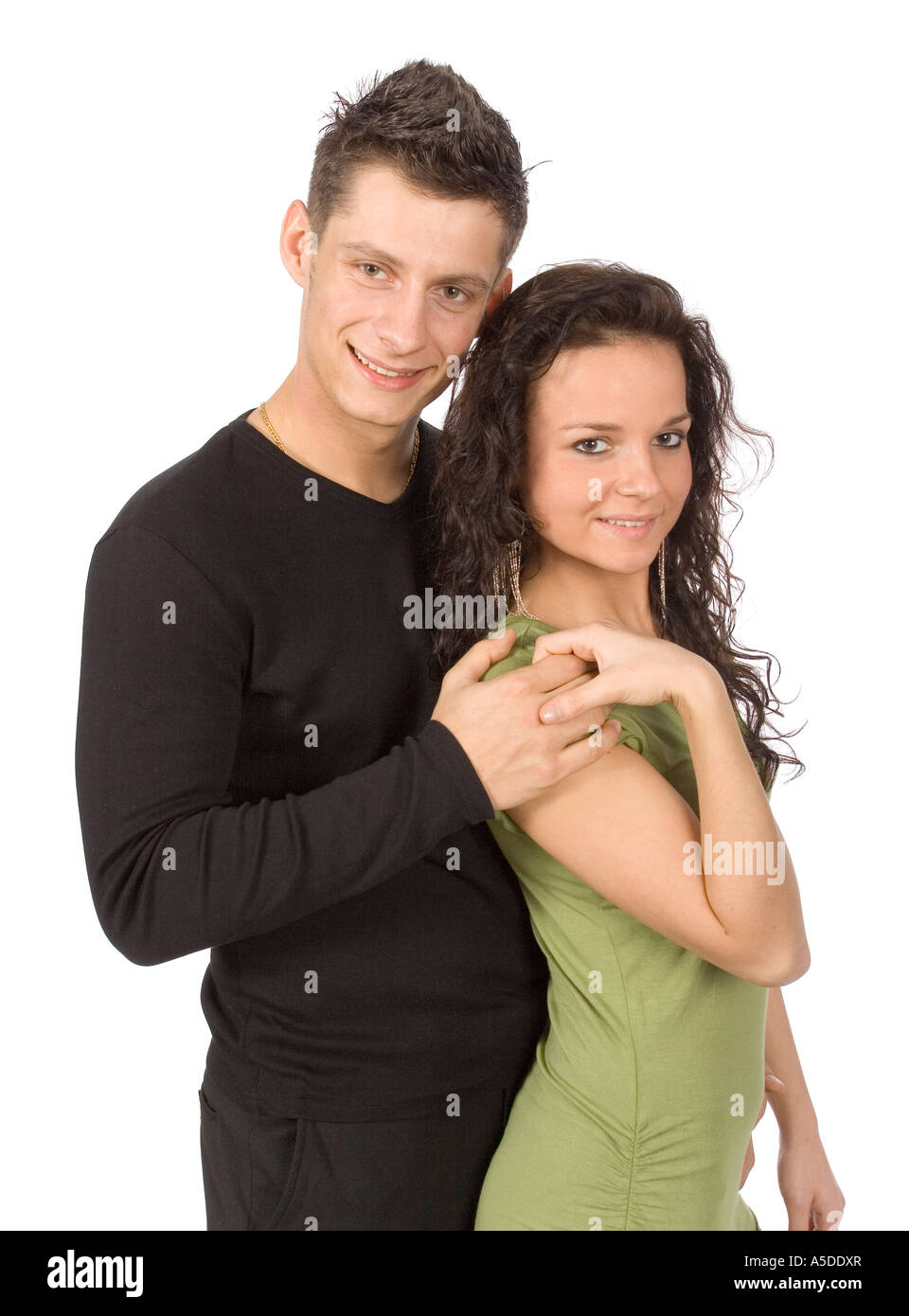 young snuggling couple on the white background Stock Photo - Alamy