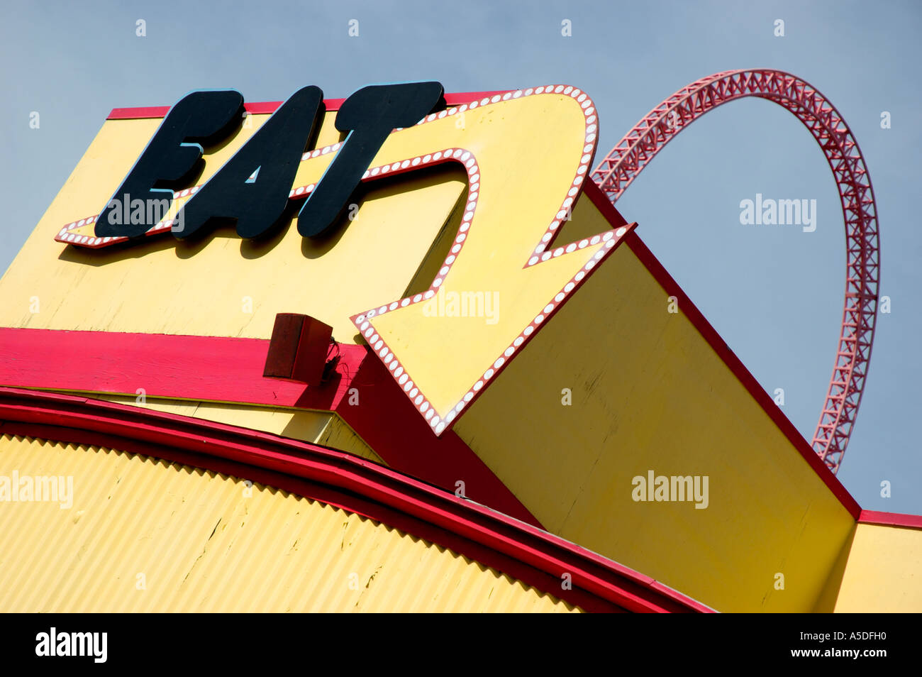 60s style restaurant sign. Rollercoaster track in the background Stock ...