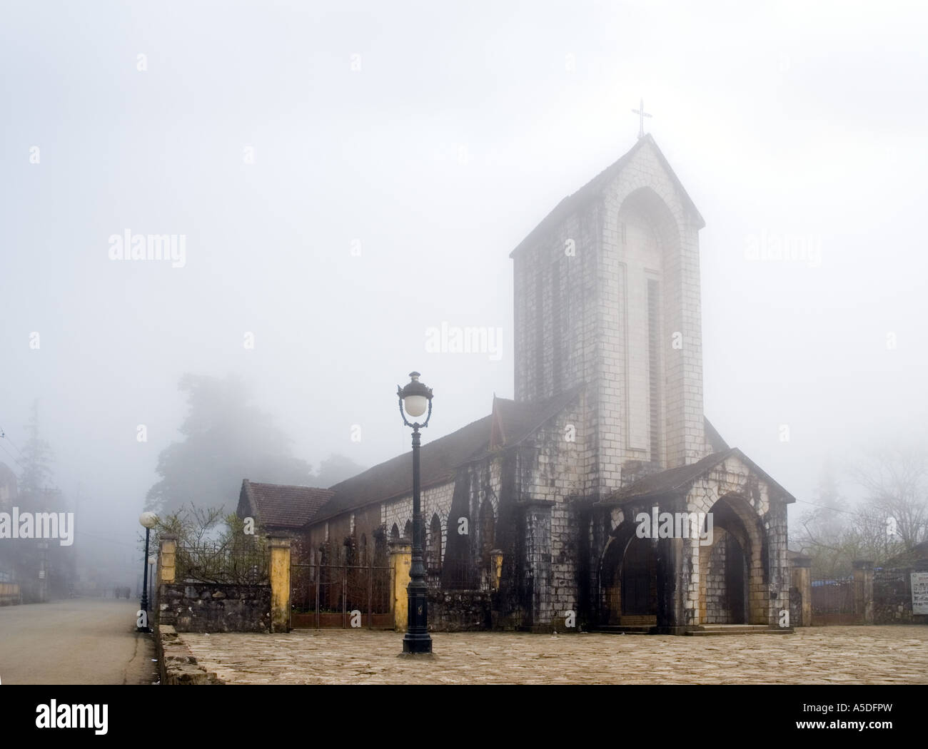 A French Church shrouded in fog in Sapa Vietnam Stock Photo - Alamy