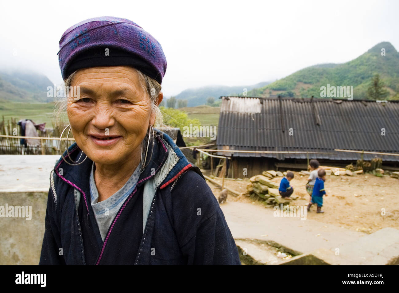 A Black Hmong tribeswoman smiles in the hills of Sapa Vietnam Stock ...