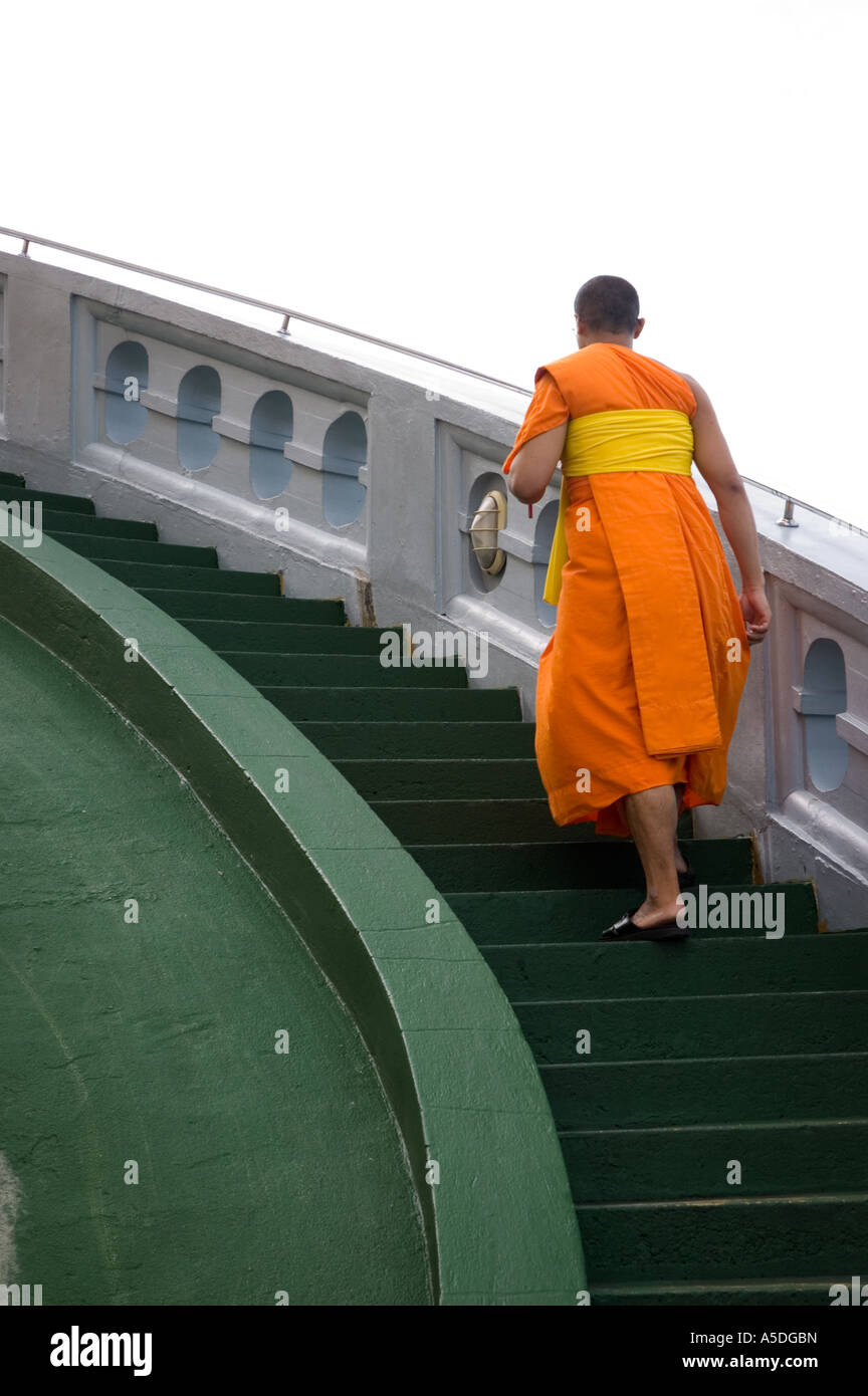 Buddhist monk climbing temple stairs hi-res stock photography and ...