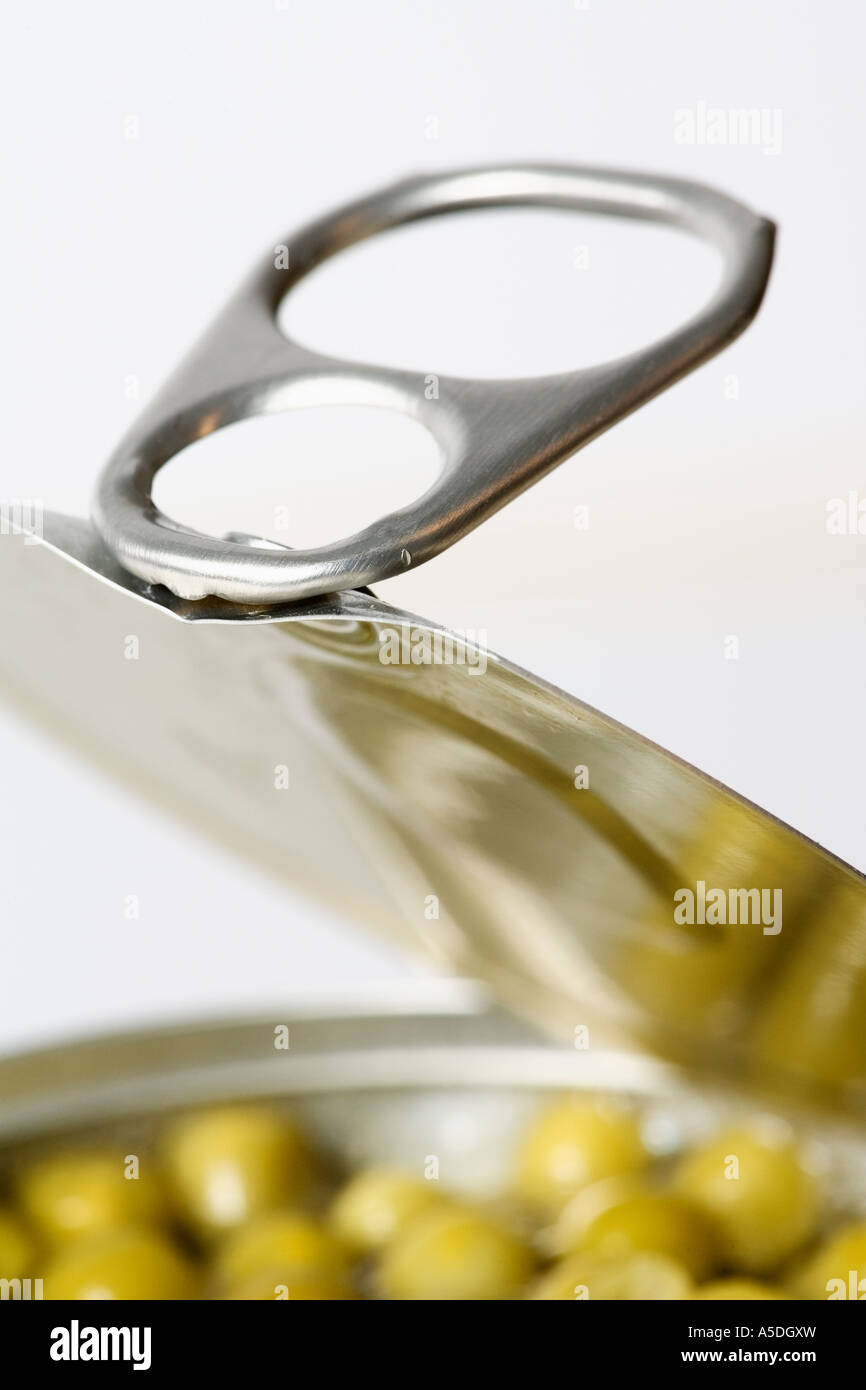 Opened tin of processed peas and ringpull opener Stock Photo - Alamy