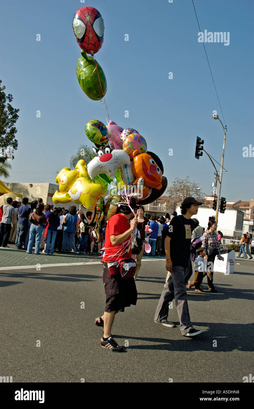 Balloon vendor walking the streets at the Chinese Lantern Festival ...