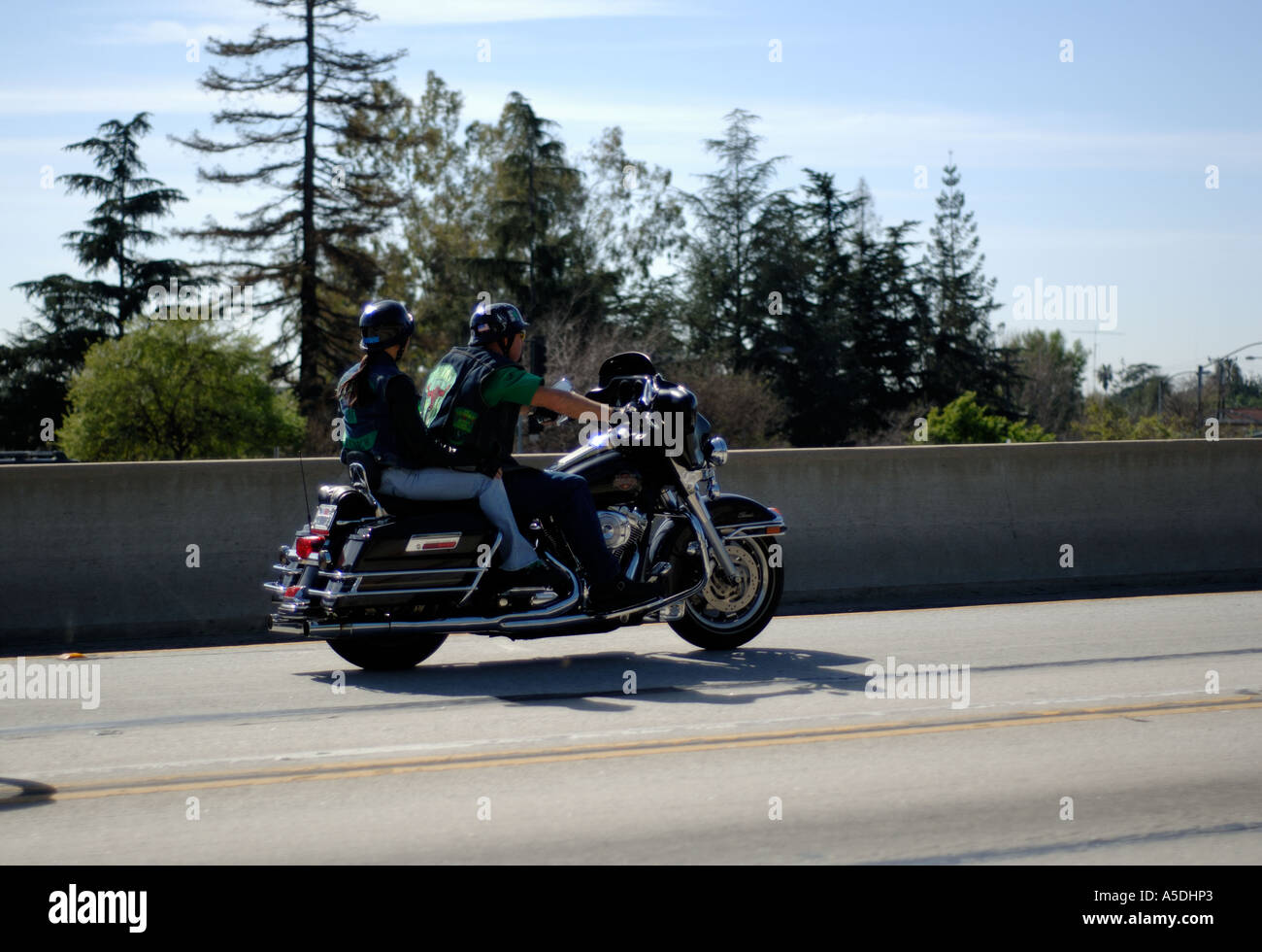 Motorcycle rider on California freeway riding Harley bike Stock Photo ...