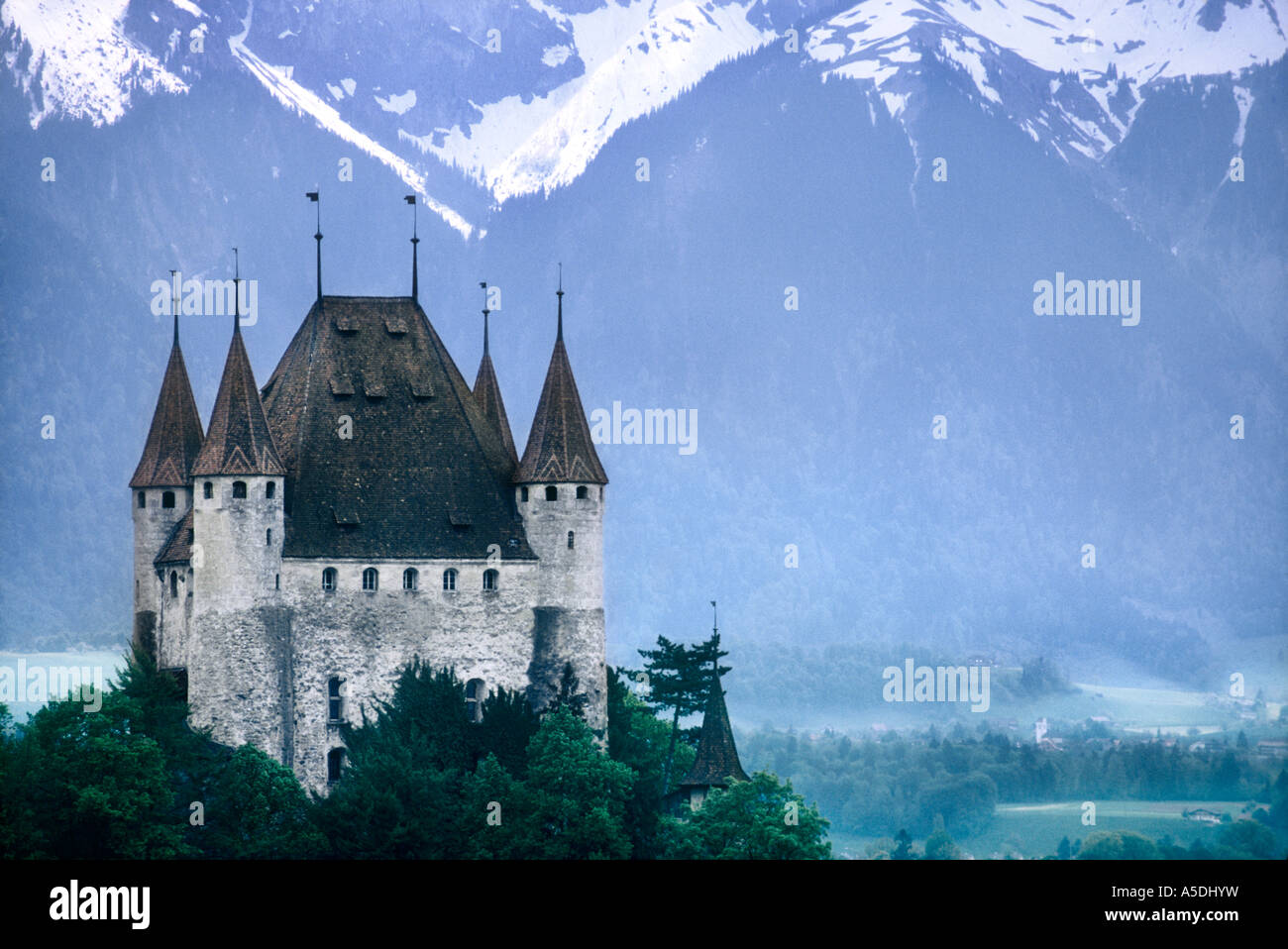 Castle Thun. romantic castle perched on small hilltop overlooking a ...